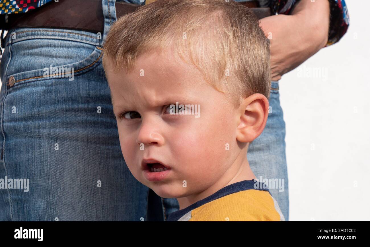 a portrait of toddler boy with angry upset face expression Stock Photo ...