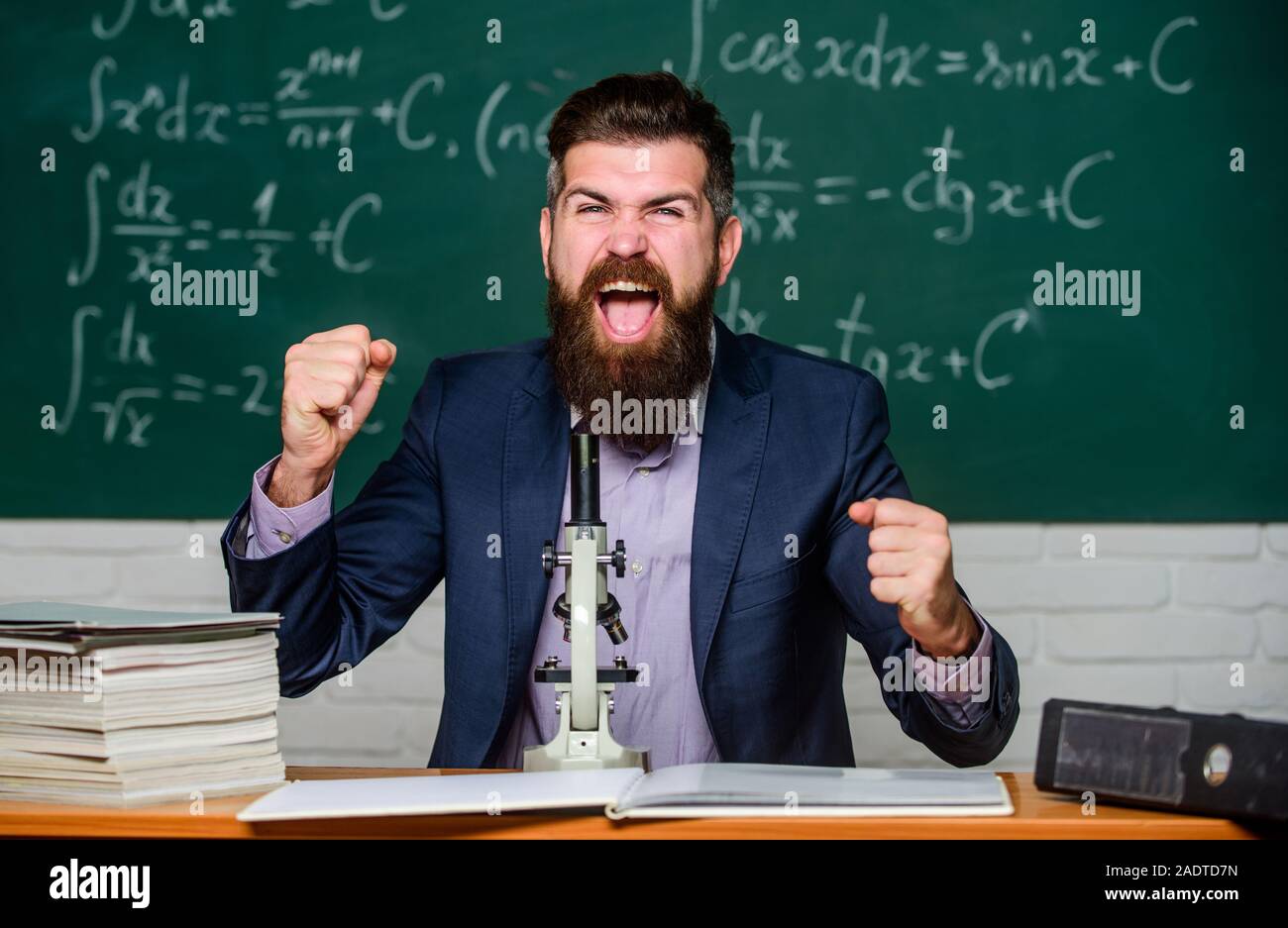 Revolutionary invention done. Happy scientist made invention. Bearded ...