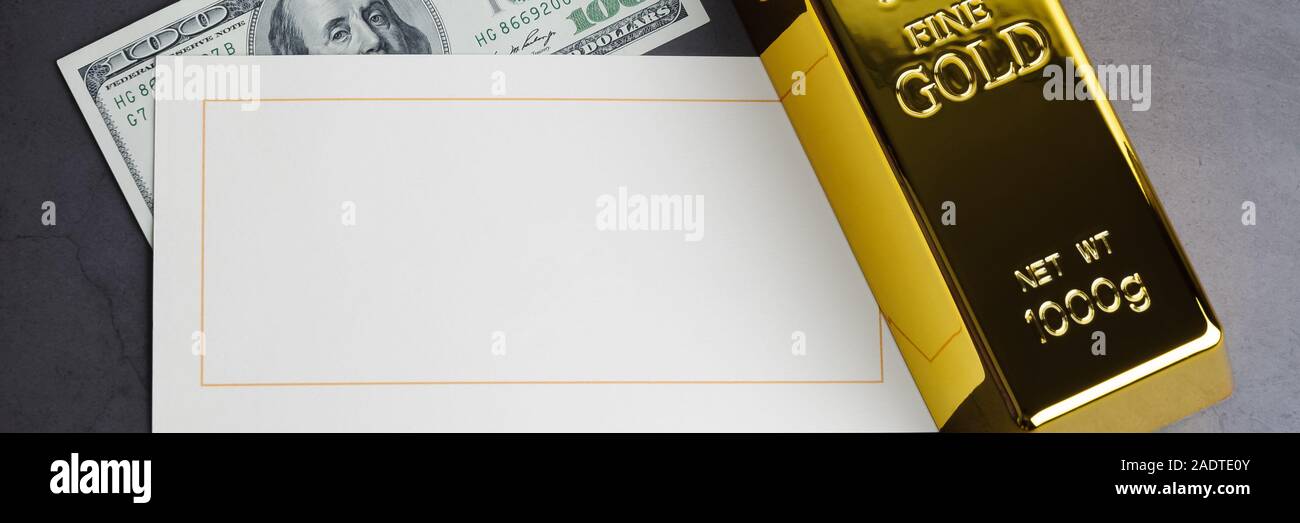 Gold bar ingot bullion dollar bill and greeting card Stock Photo - Alamy