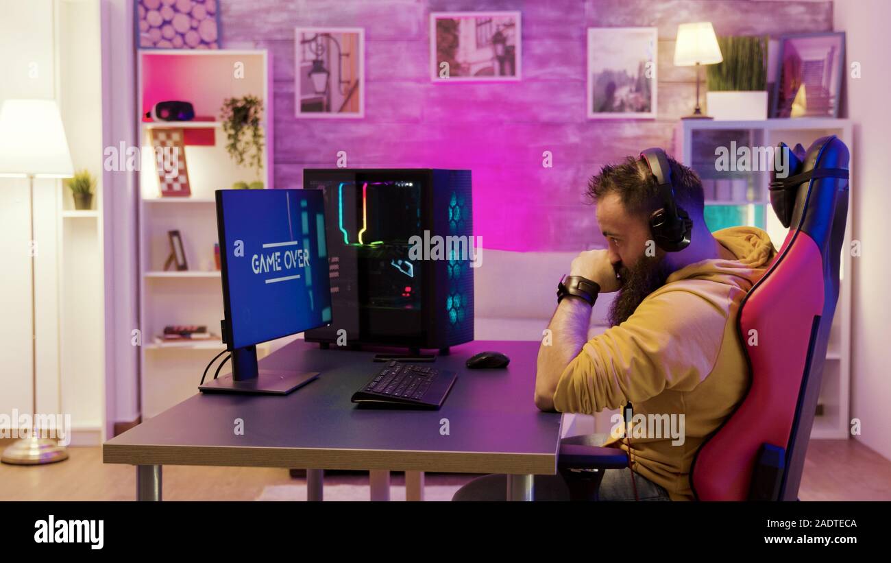 Upset professional game player after losing an important online game ...