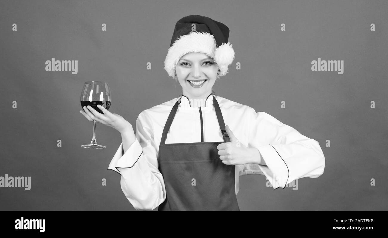Woman chef cooking wear santa hat drink wine. Best christmas recipes ...