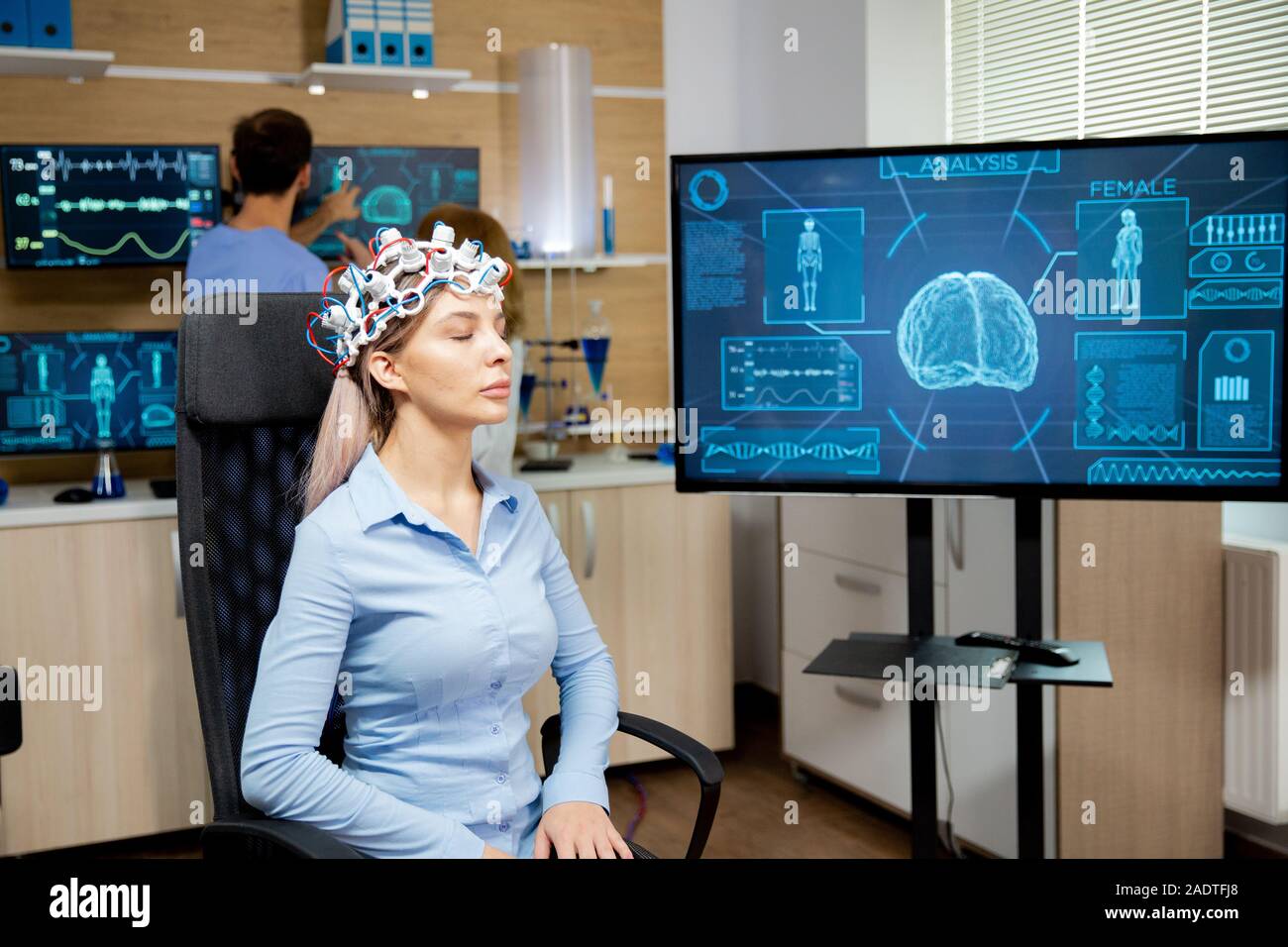 Female patient who is in a neurology clinic and her brain is being ...