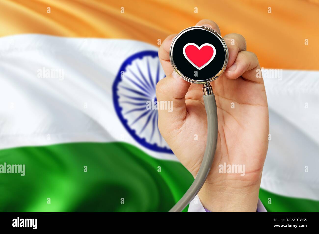 Doctor holding stethoscope with red love heart. National India flag ...