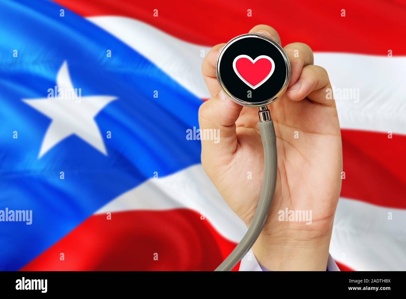 Doctor holding stethoscope with red love heart. National Puerto Rico ...