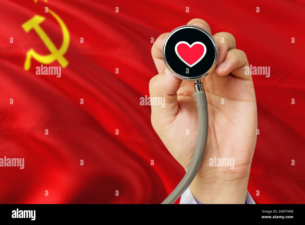 Doctor holding stethoscope with red love heart. National Soviet Union ...