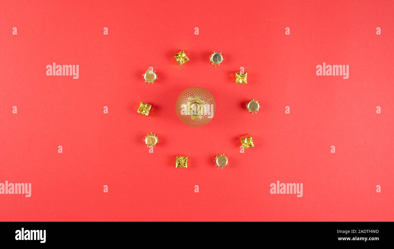 Stop motion animation of New Years balls and gift dancing around big ...