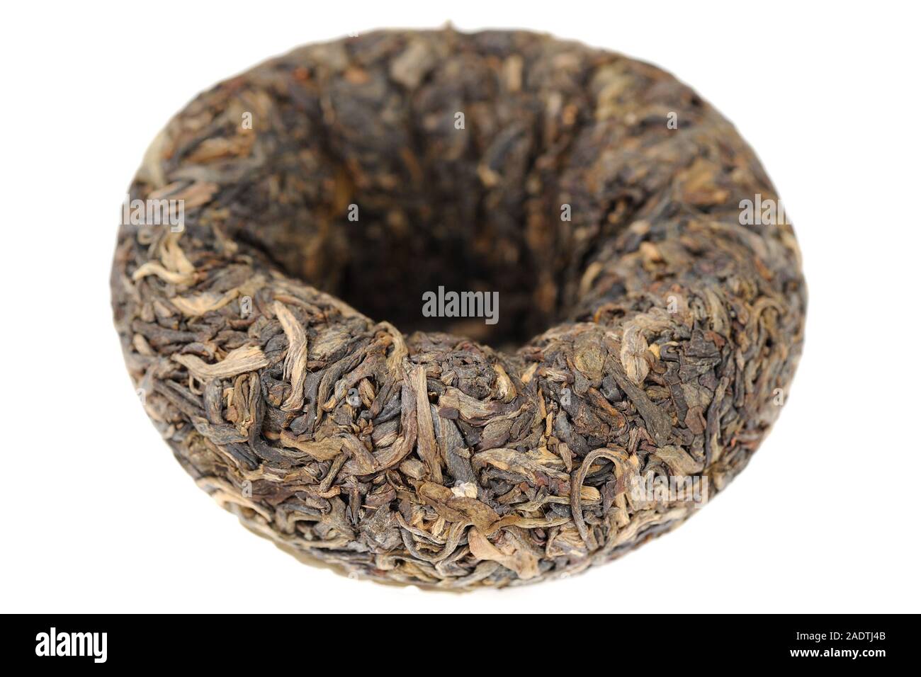 Raw green puerh tea bowl shape tuo cha closeup isolated Stock Photo - Alamy