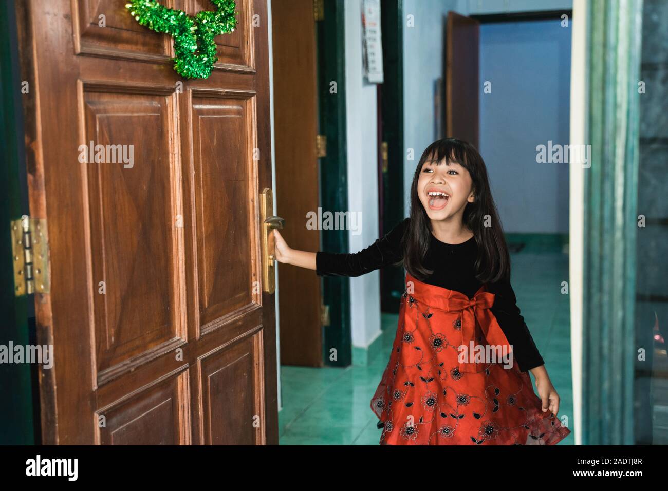 young kid excited to welcome family Stock Photo - Alamy