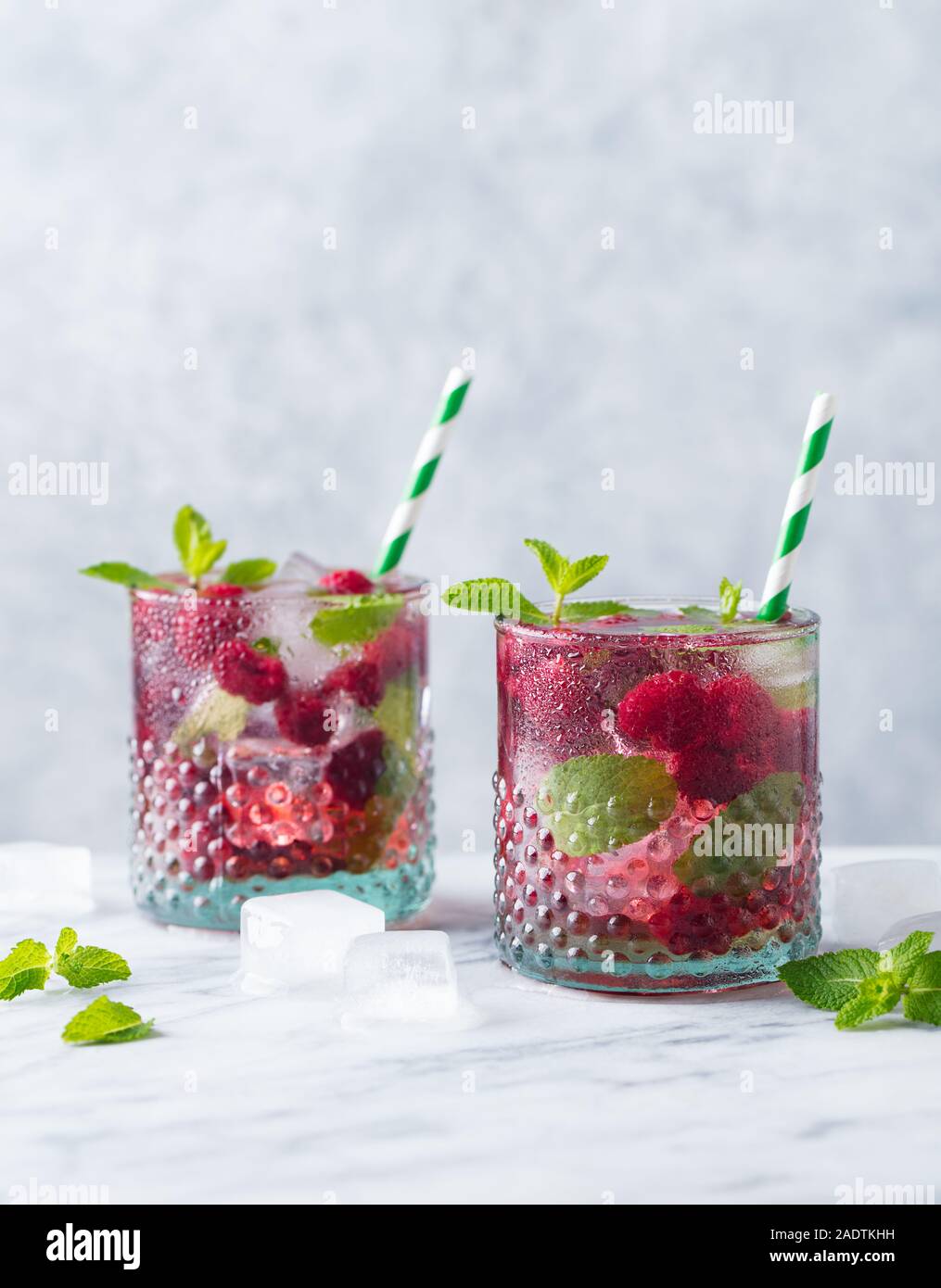 Raspberry cocktail, fizz, lemonade, ice tea with fresh mint on marble ...