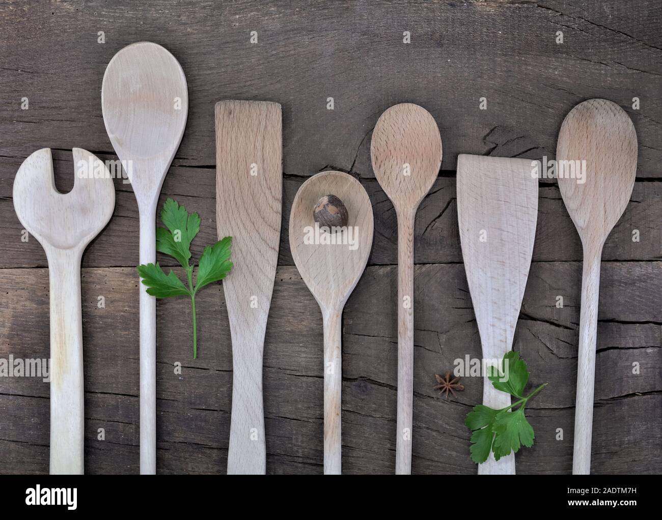 top view on rustic wooden spatula and spoons arranged on a plank Stock ...