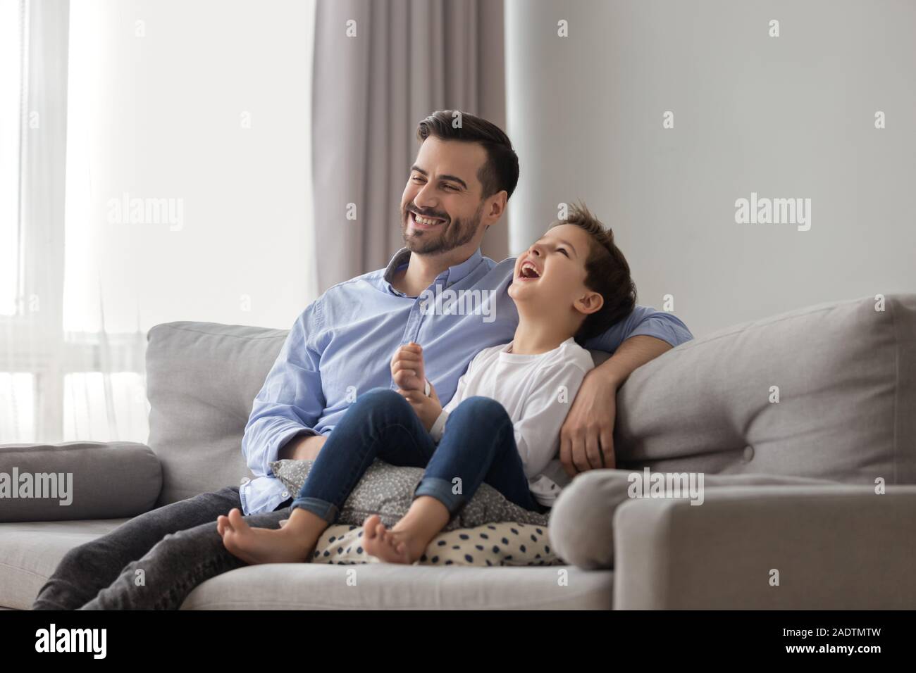 Father talking to child laughing hi-res stock photography and images ...