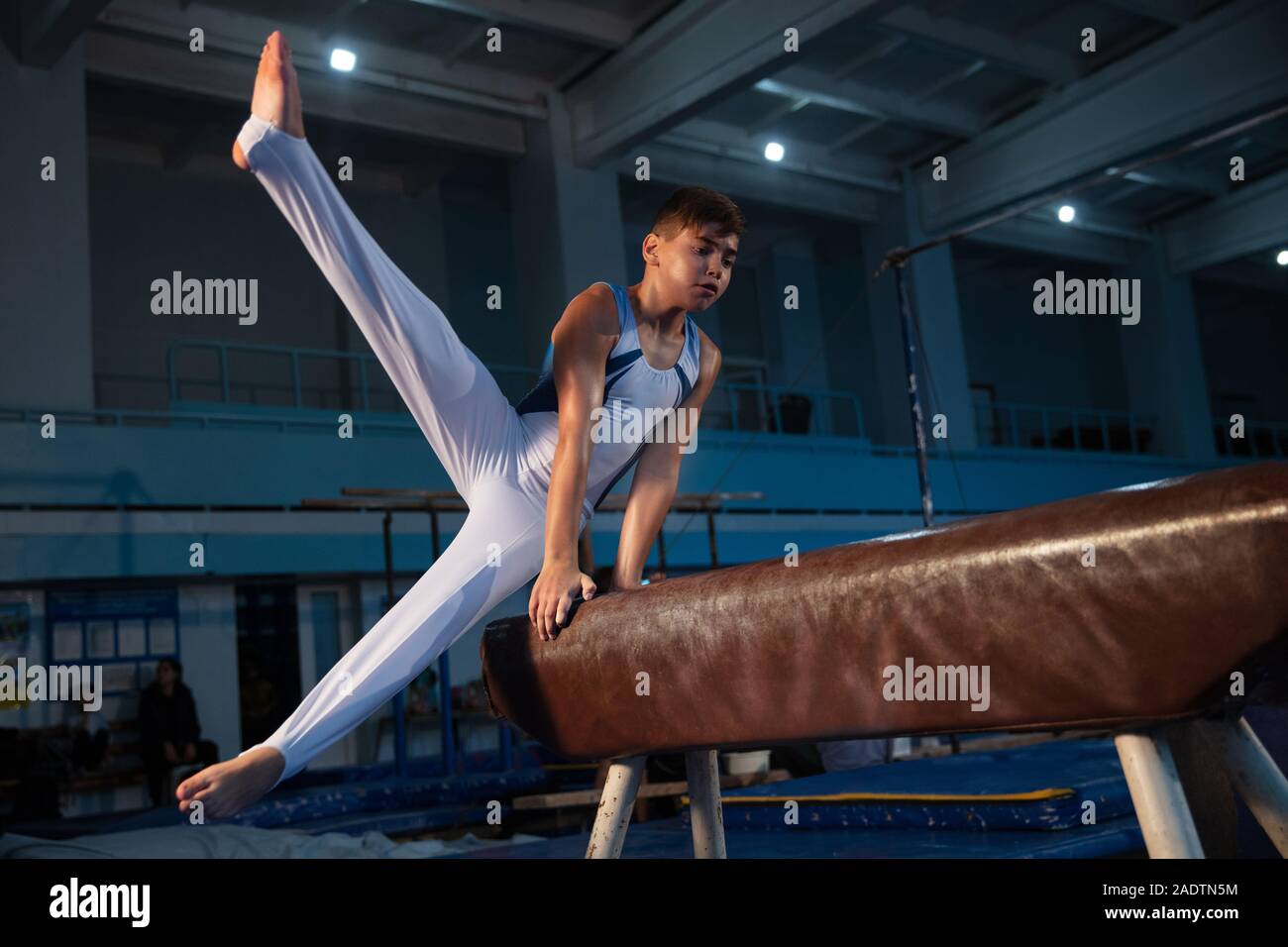 Little male gymnast training in gym, flexible and active. Caucasian fit ...