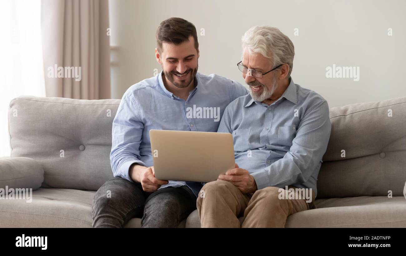 Younger man talking older man hi-res stock photography and images - Alamy