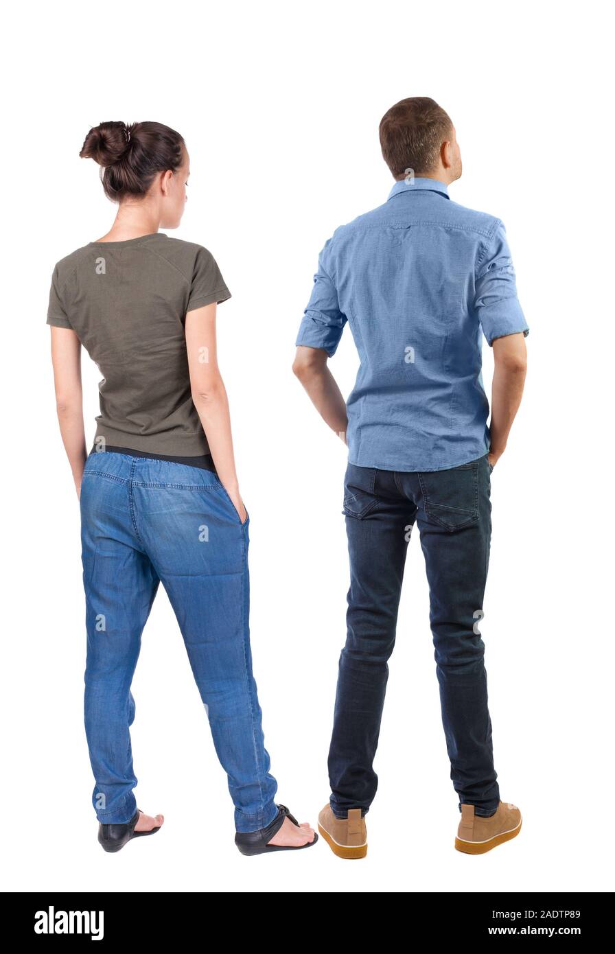 Back view of couple. beautiful friendly girl and guy together. Rear ...