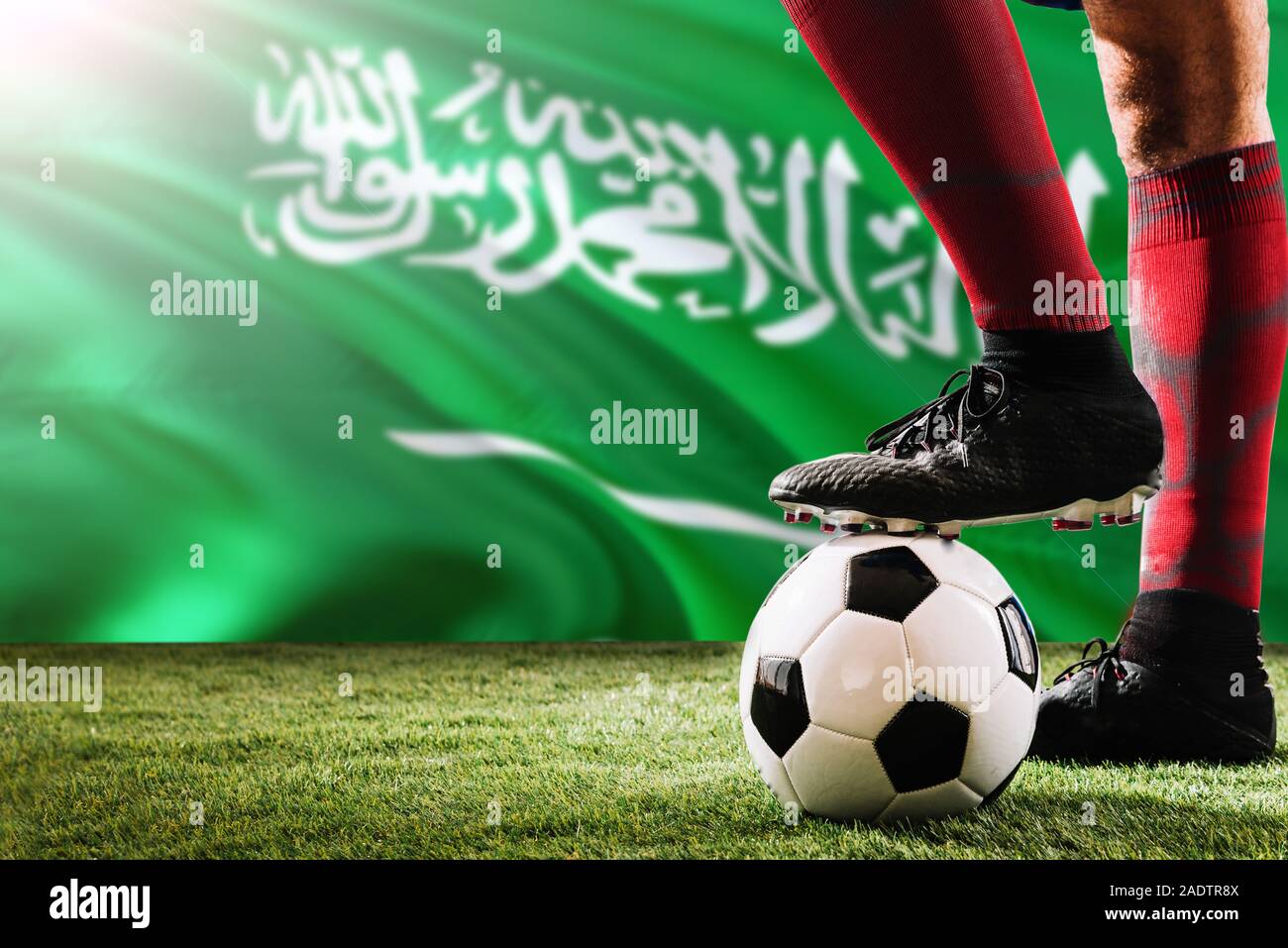 Close up legs of Saudi Arabia football team player in red socks, shoes ...