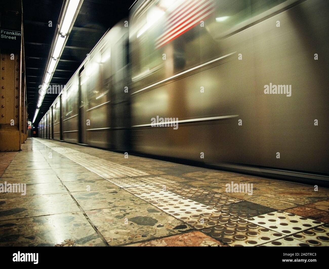 Interior view of subway moving through station in NYC Stock Photo - Alamy