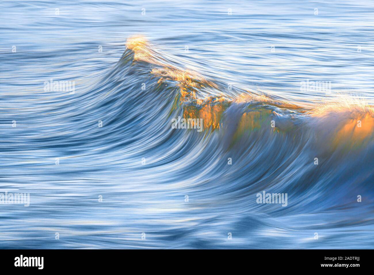 smooth wave in motion with panning effect and beautiful sunset light ...