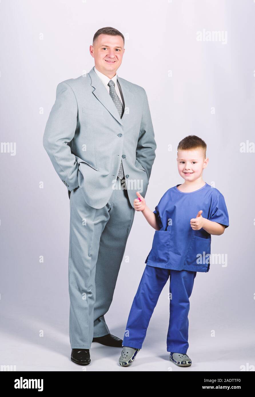 Doctor respectable career. Dad boss. Father and cute small son. Child ...