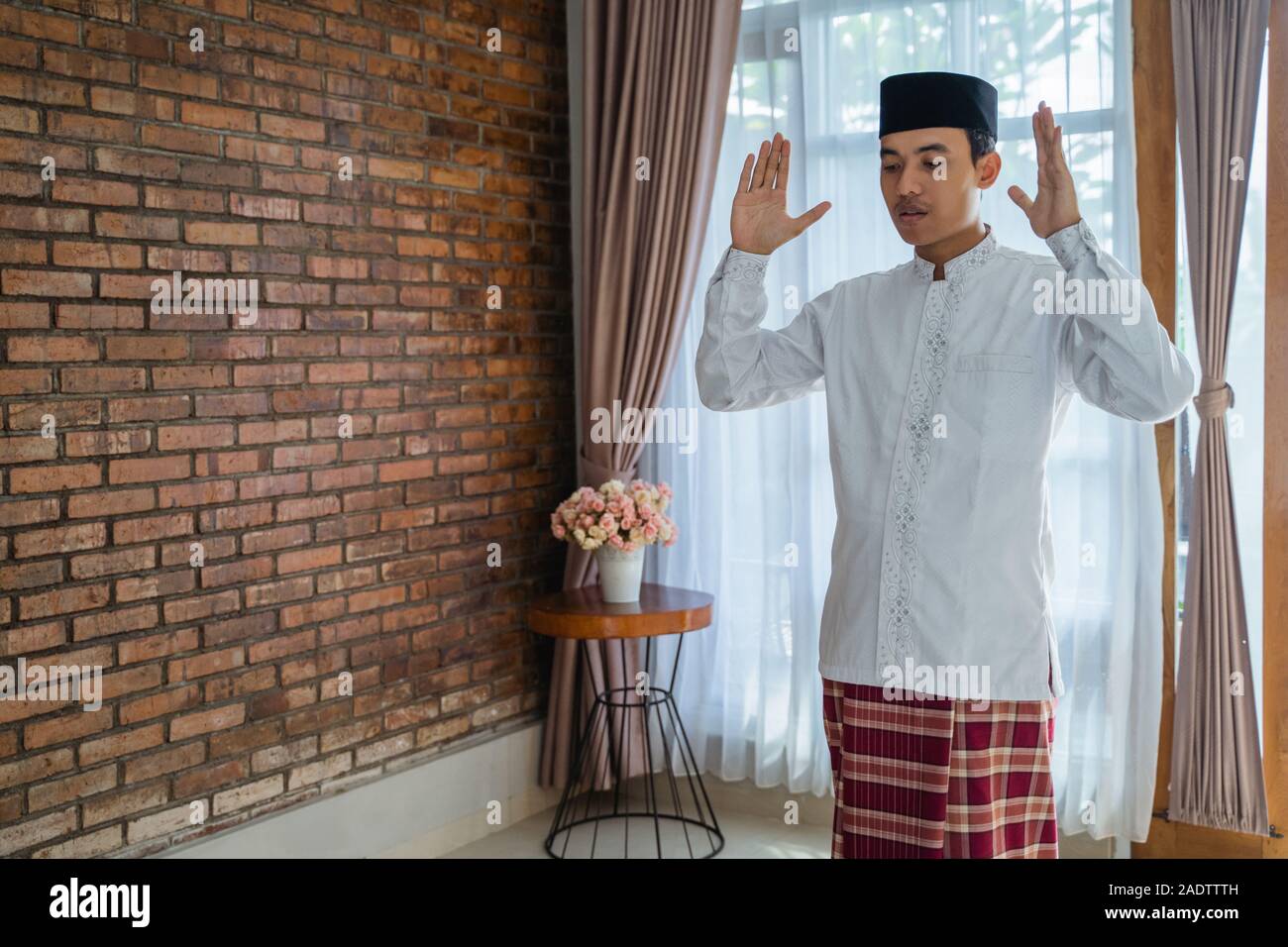 muslim man solat or praying Stock Photo - Alamy