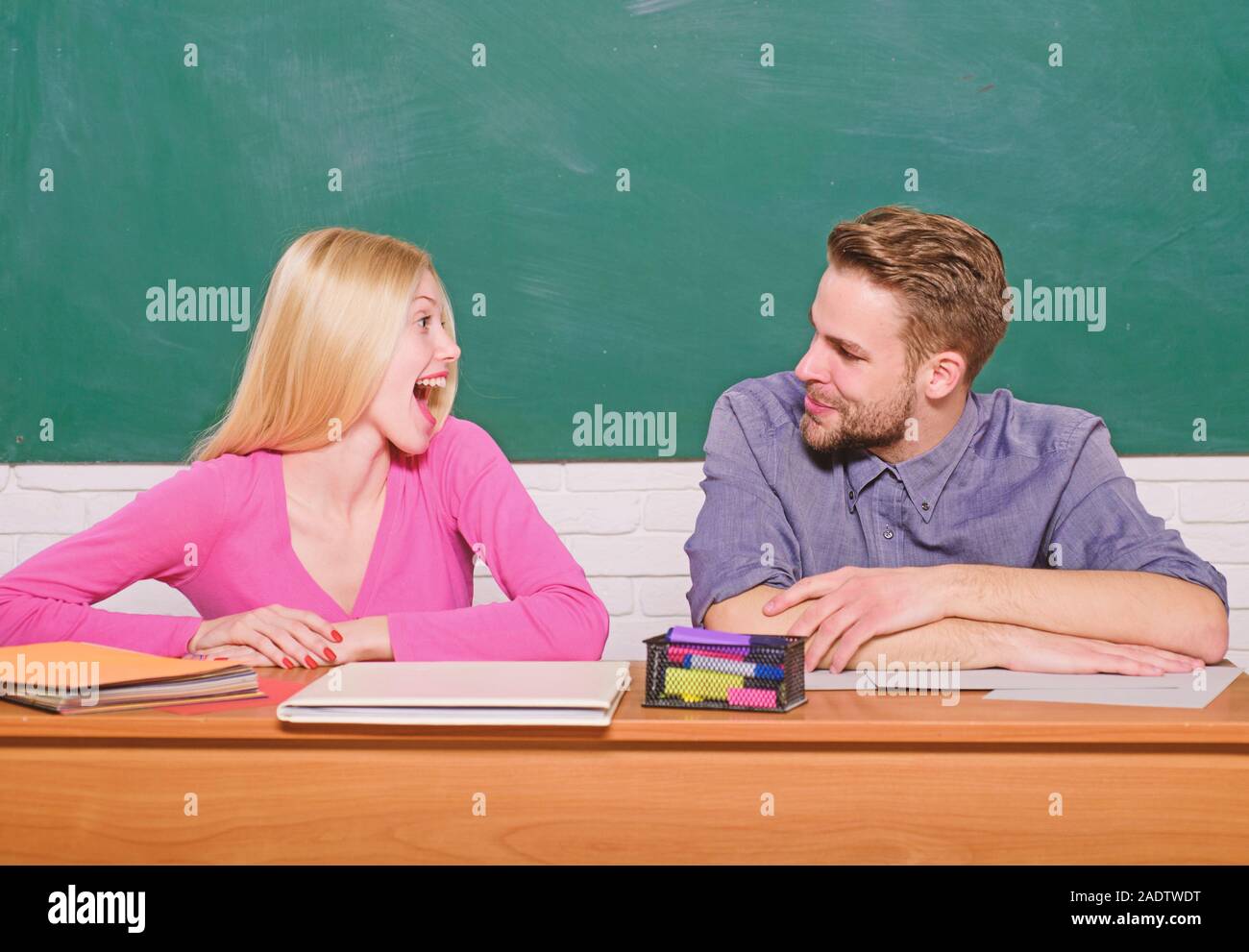 Couple of man and woman in classroom. Modern school. Knowledge day ...
