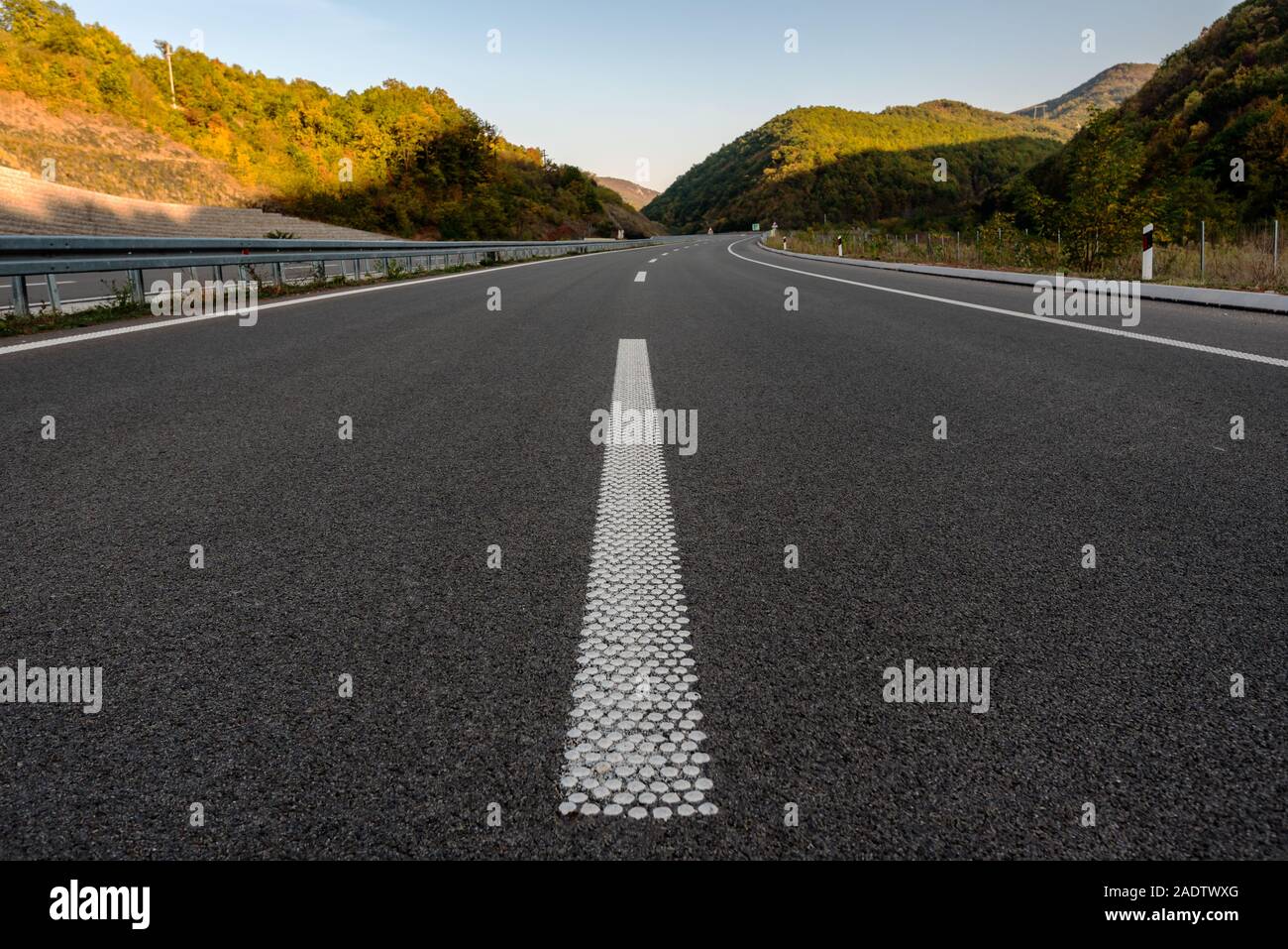 Empty silent Asphalt highway road with close up white markings Stock ...