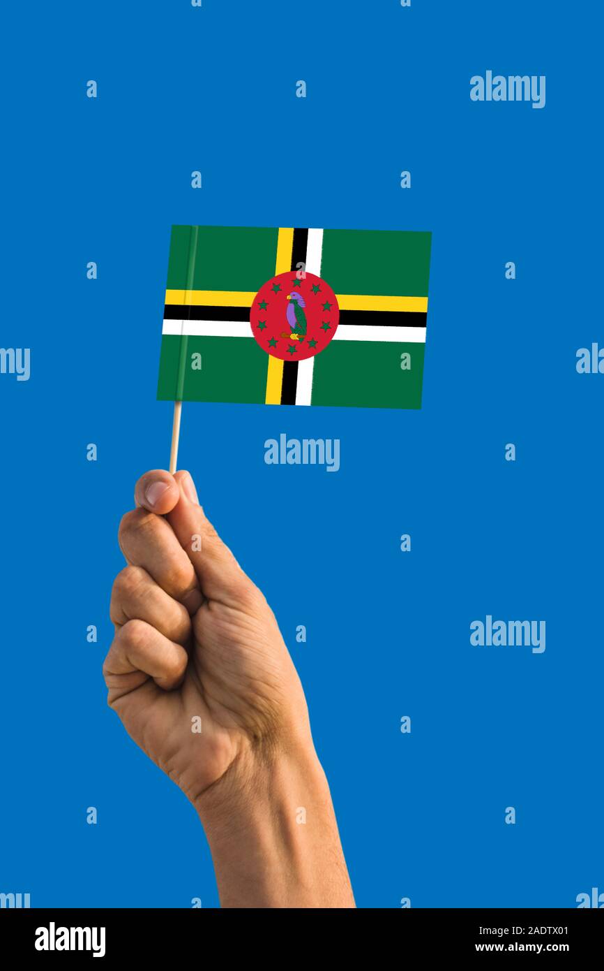 Blue sky background with dominica flag hi-res stock photography and ...
