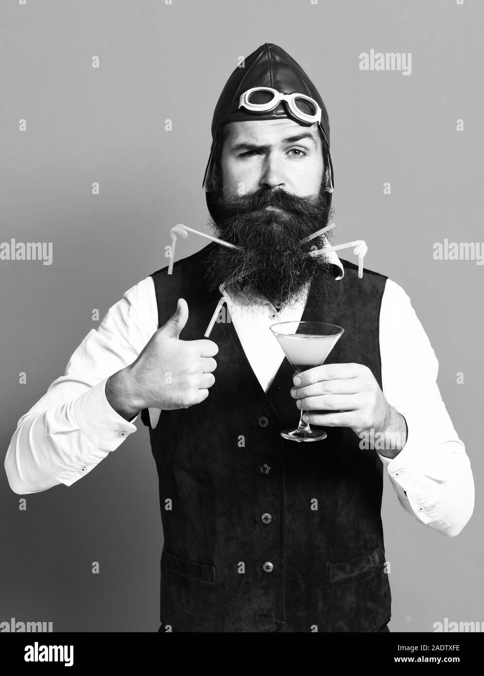 handsome bearded pilot or aviator man with long beard and mustache on ...