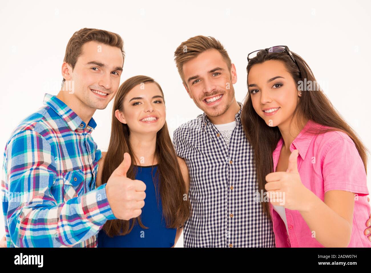 Happy cheerful group showing thumbs up Stock Photo - Alamy
