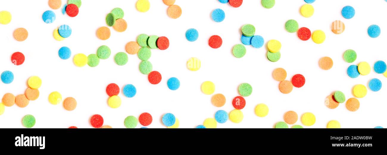 Header, colorful sugar confetti or sprinkles on white background ...