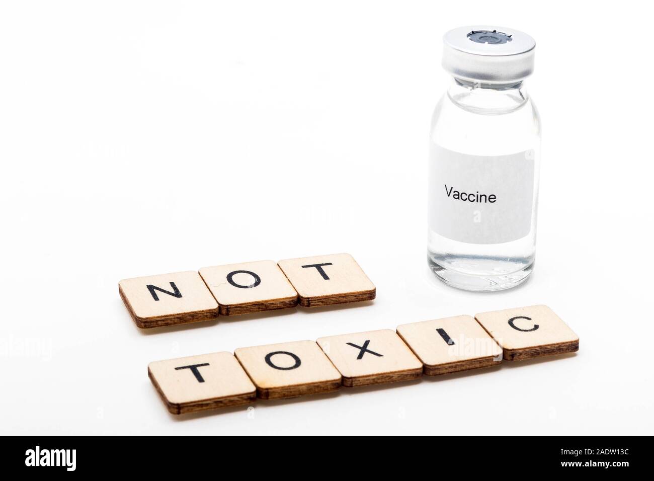 Vaccine concept showing a medical vial with a Vaccine label on a white ...