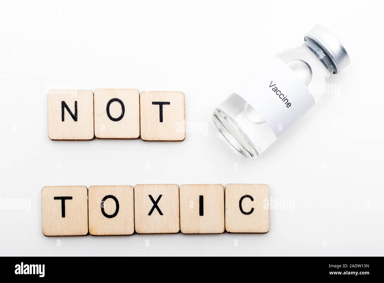 Vaccine concept showing a medical vial with a Vaccine label on a white ...