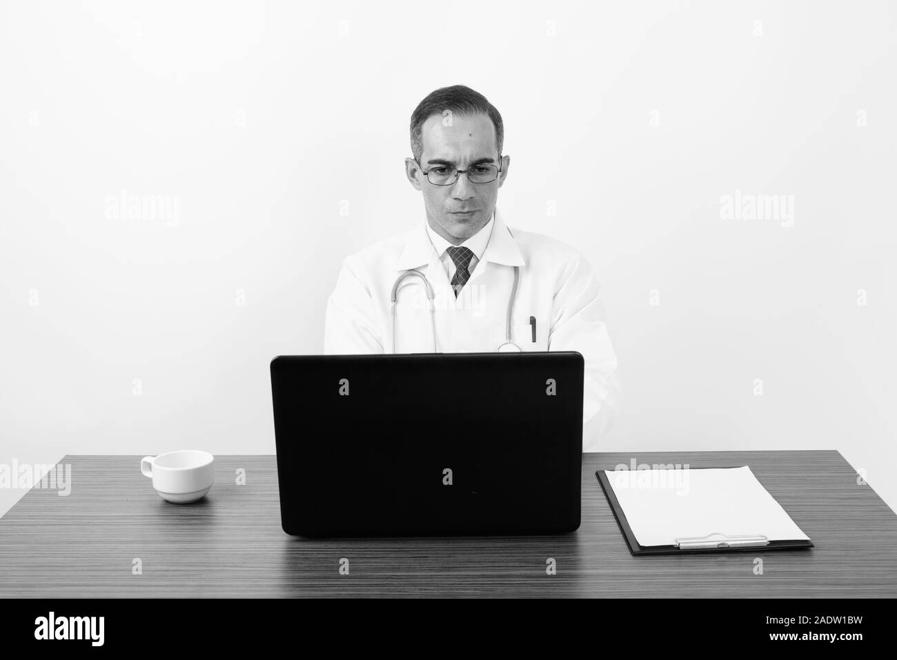 Black man sitting behind using laptop hi-res stock photography and ...
