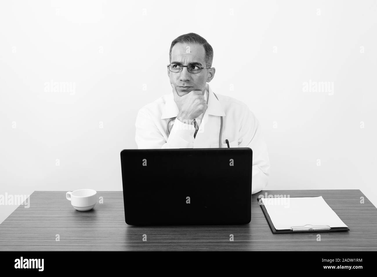 Male sitting desk laptop in Black and White Stock Photos & Images - Alamy