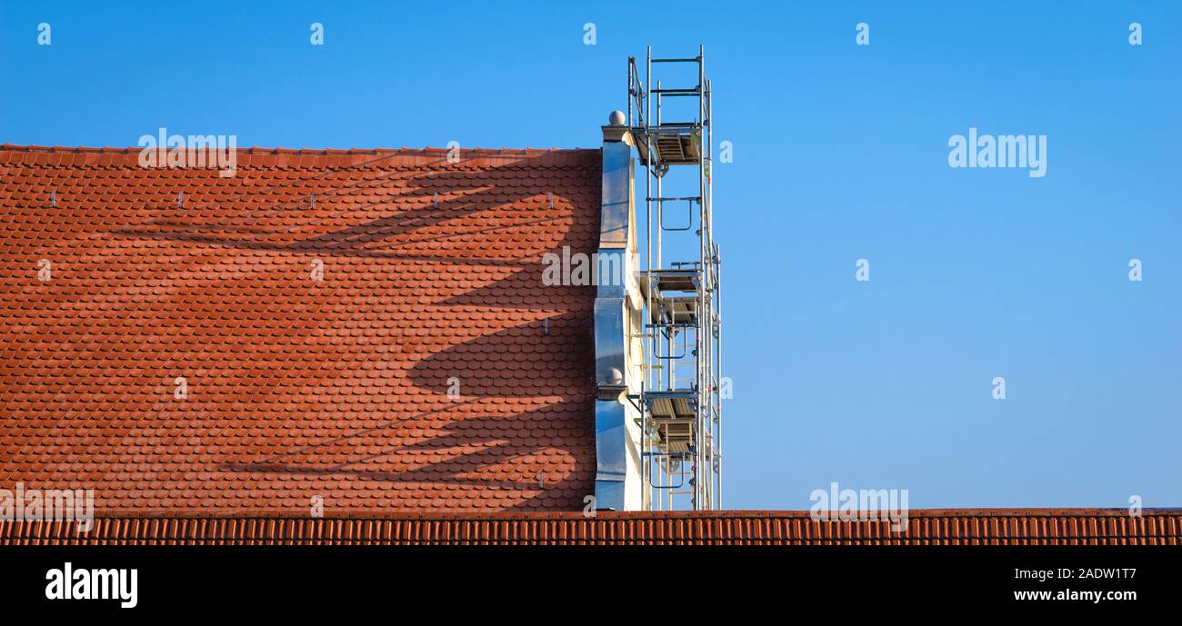 Scaffolding on an old front facade in side view Stock Photo - Alamy