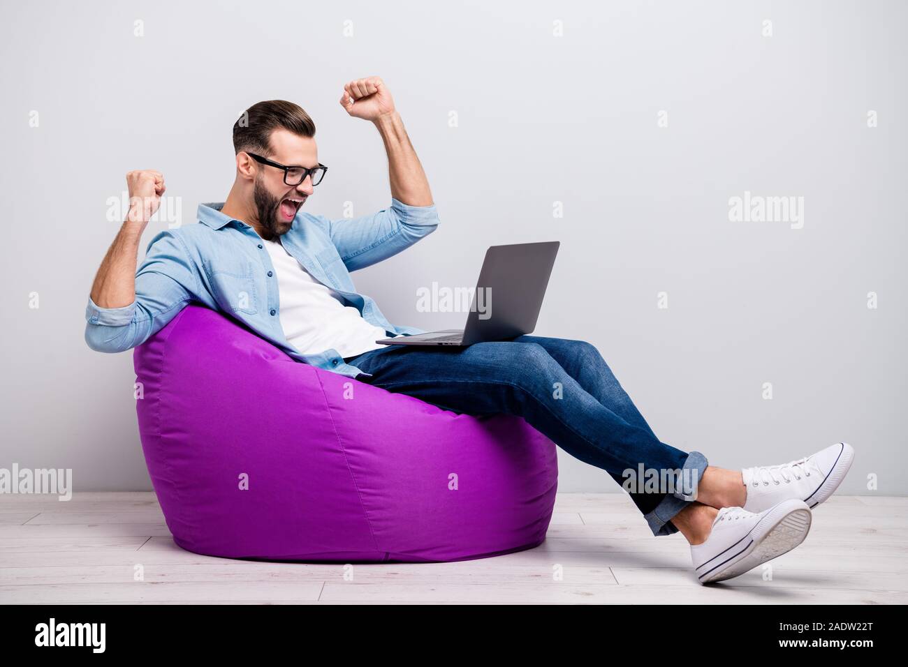 Full size profile photo of funny guy holding notebook sitting comfy ...