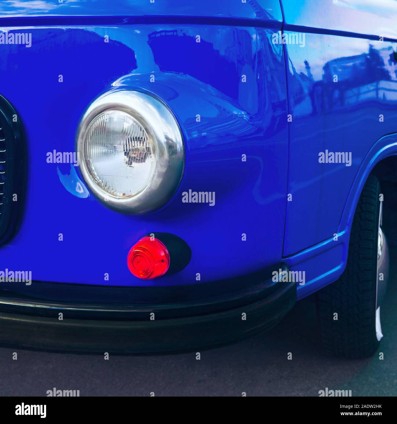Blue retro car with round headlights close up. Trendy color concept ...