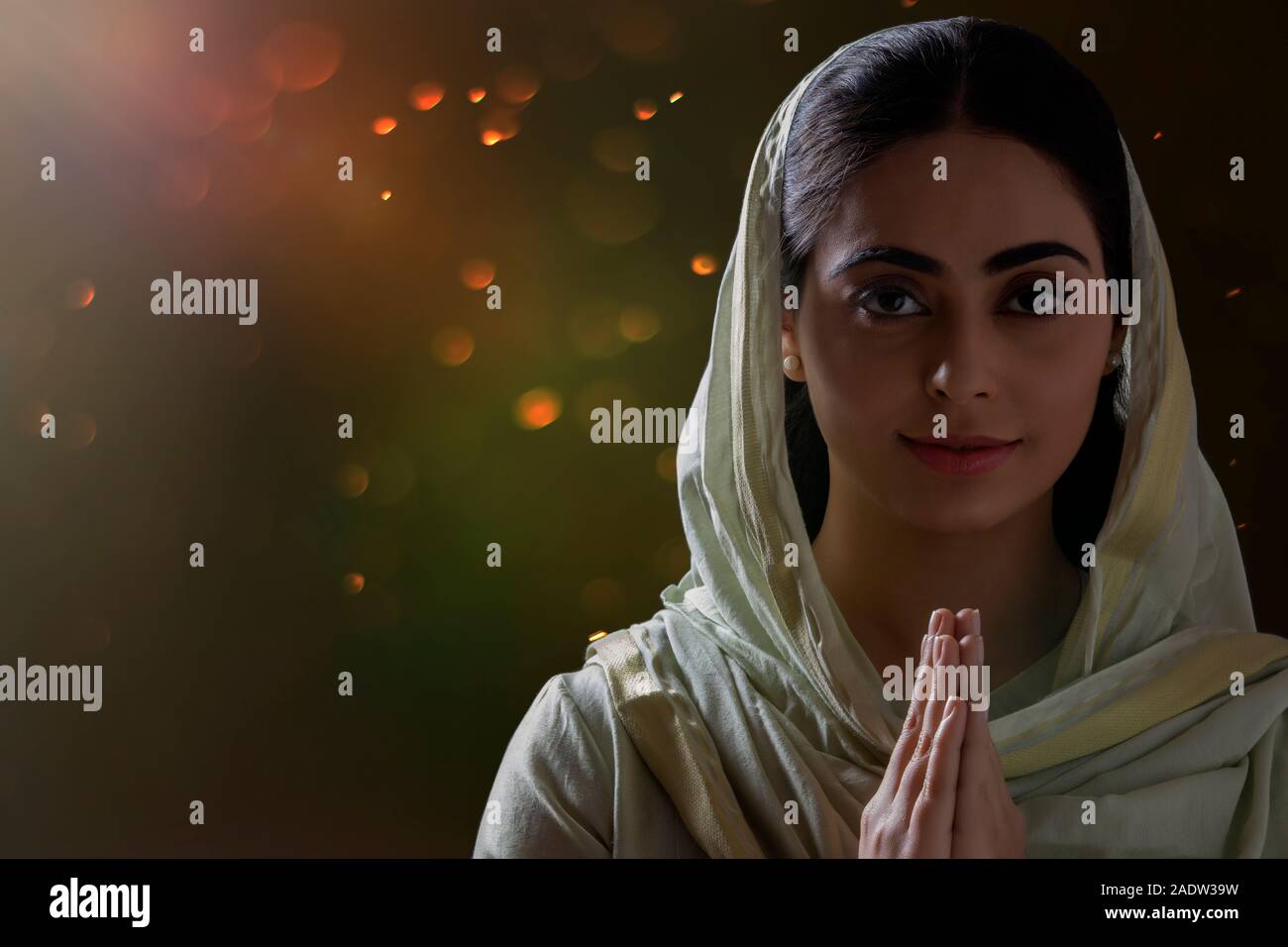 One woman praying looking up hi-res stock photography and images - Alamy