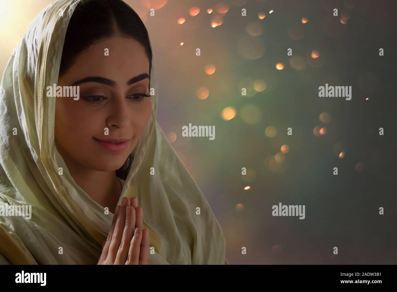 One woman praying looking up hi-res stock photography and images - Alamy