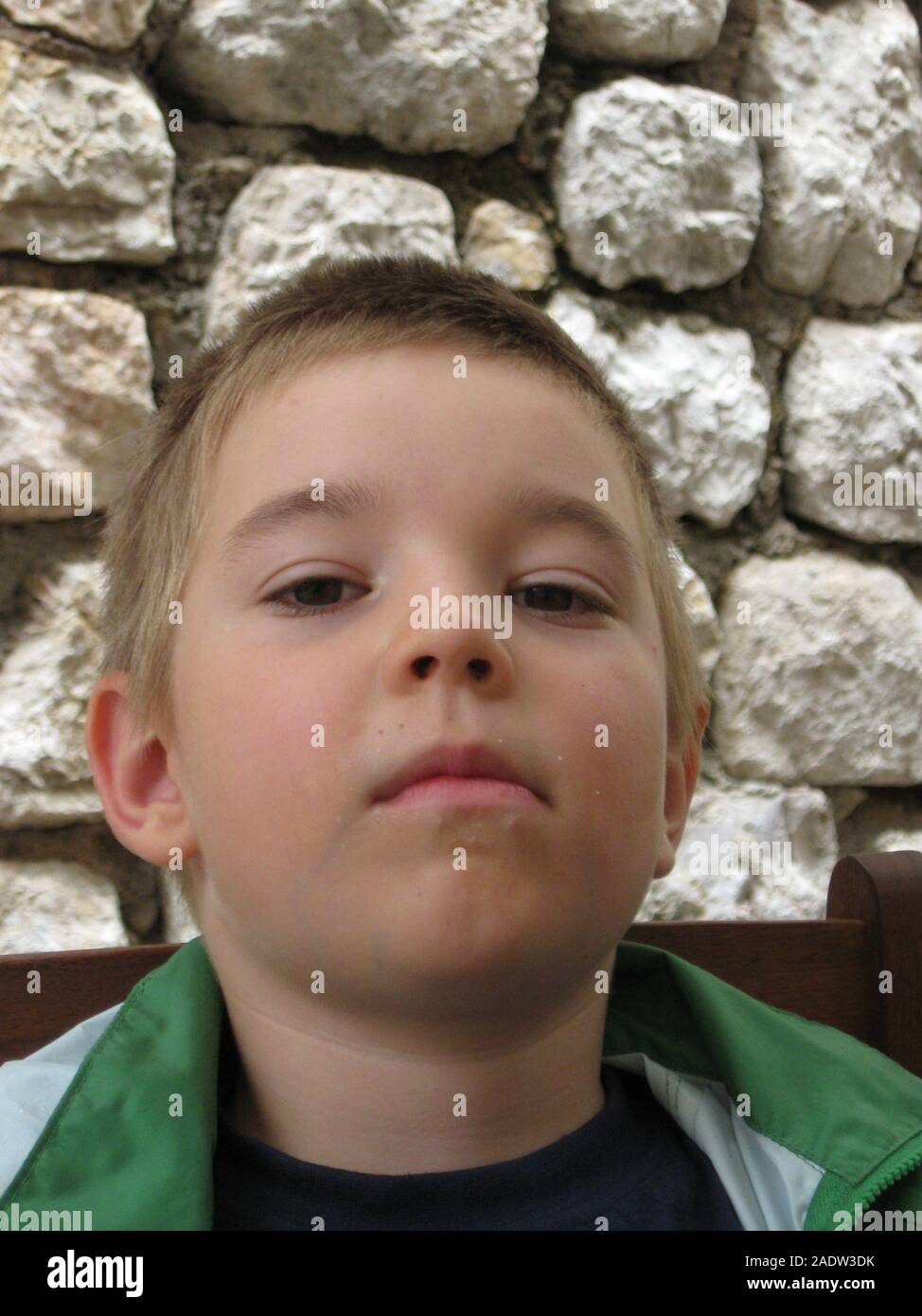 Boy portrait, stony background, funny face expression Stock Photo - Alamy