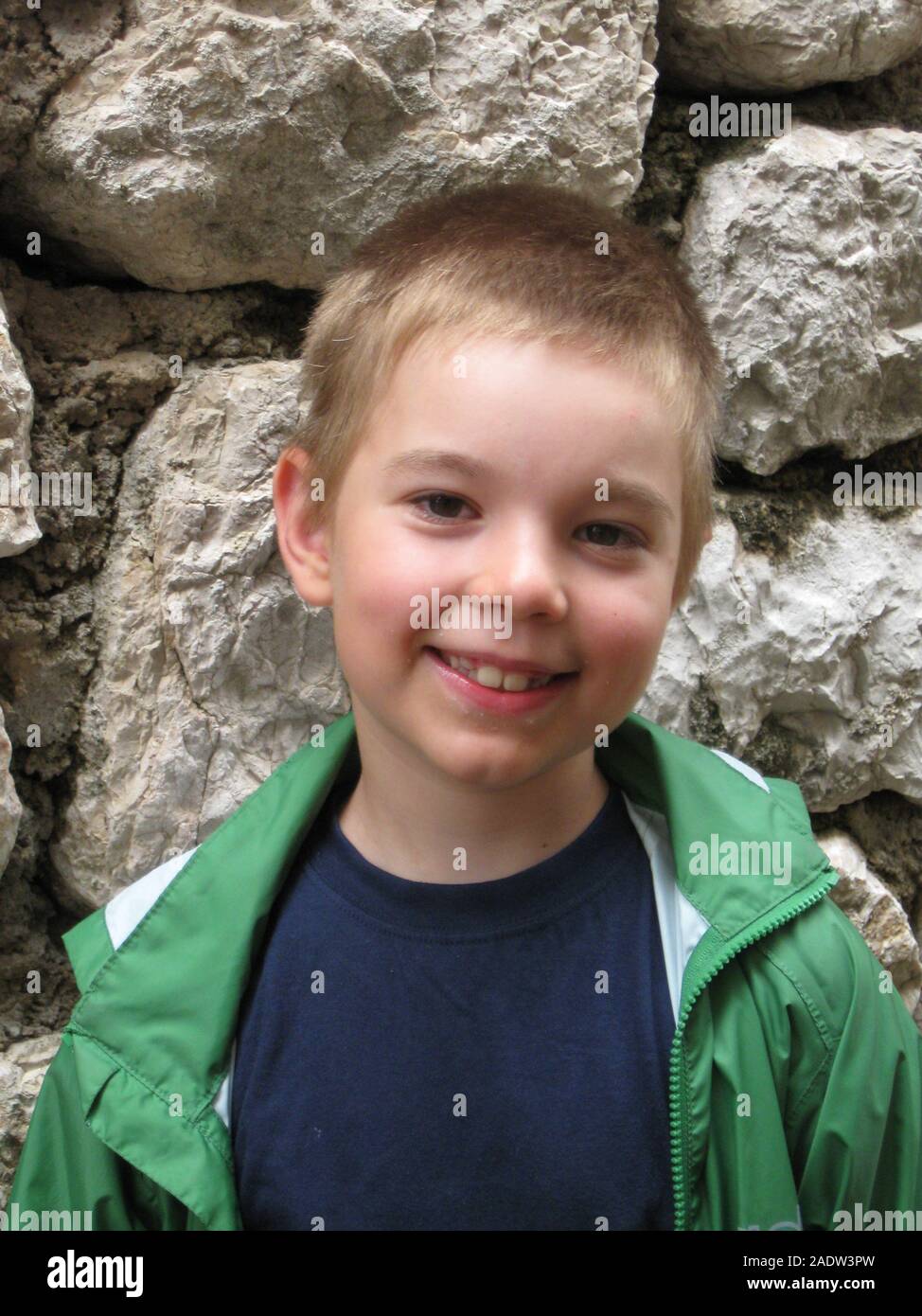 Boy portrait, stony background, funny face expression Stock Photo - Alamy