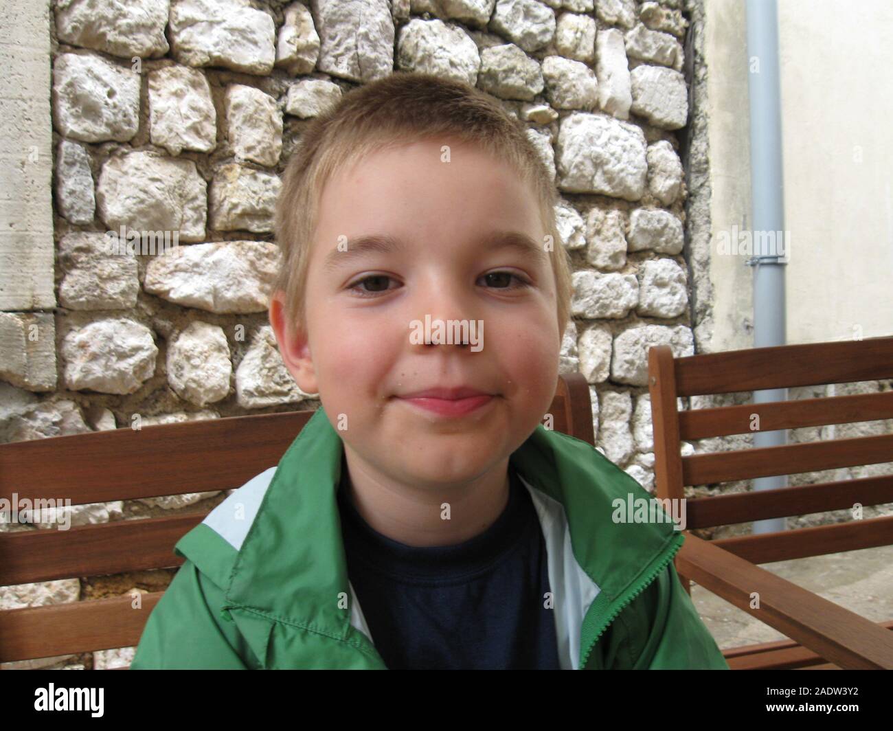Boy portrait, stony background, funny face expression Stock Photo - Alamy