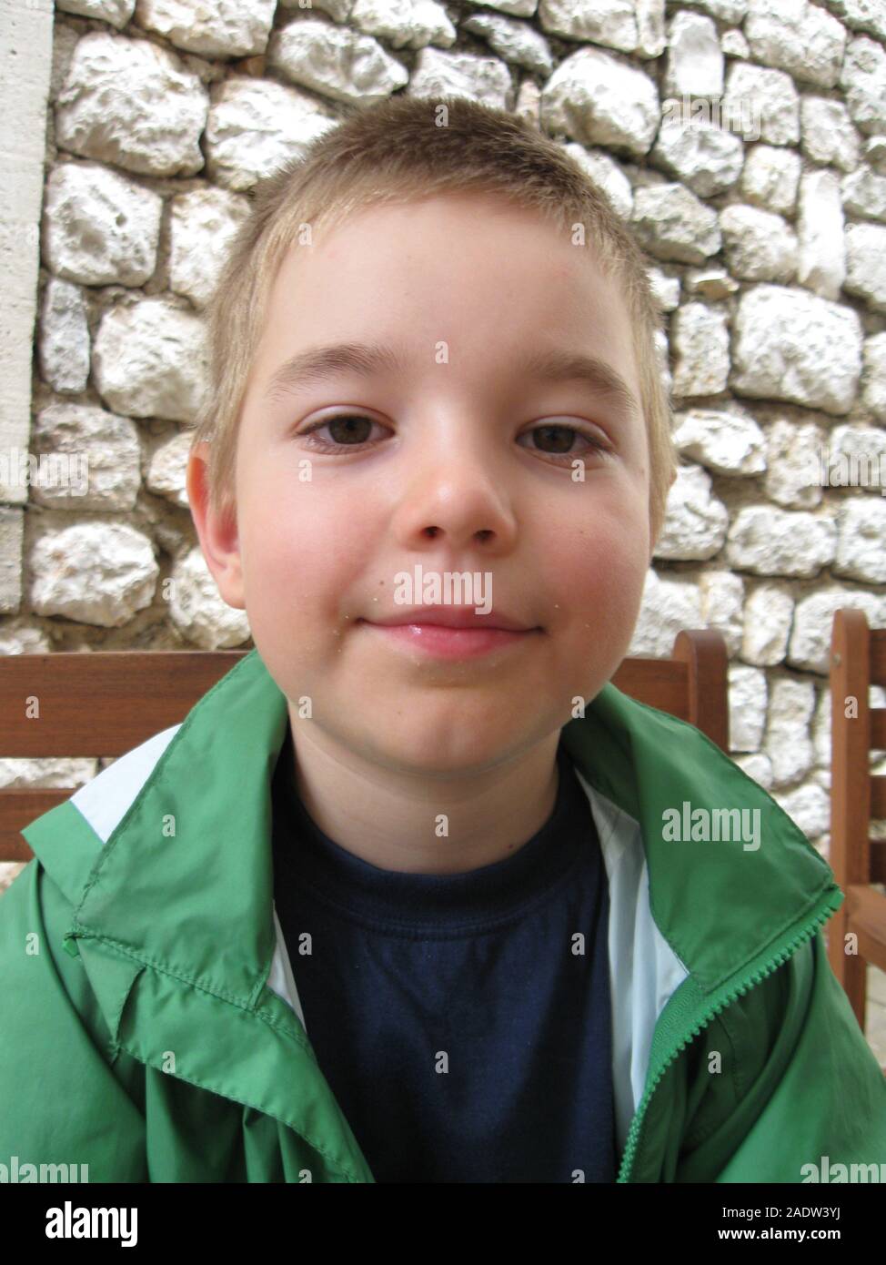 Boy portrait, stony background, funny face expression Stock Photo - Alamy