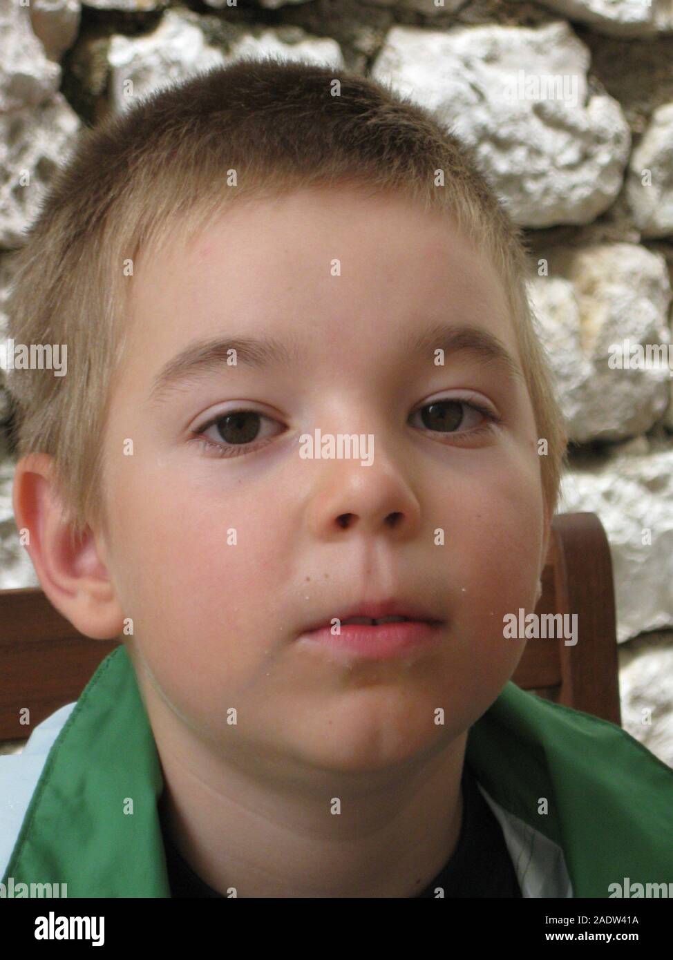 Boy portrait, stony background, funny face expression Stock Photo - Alamy