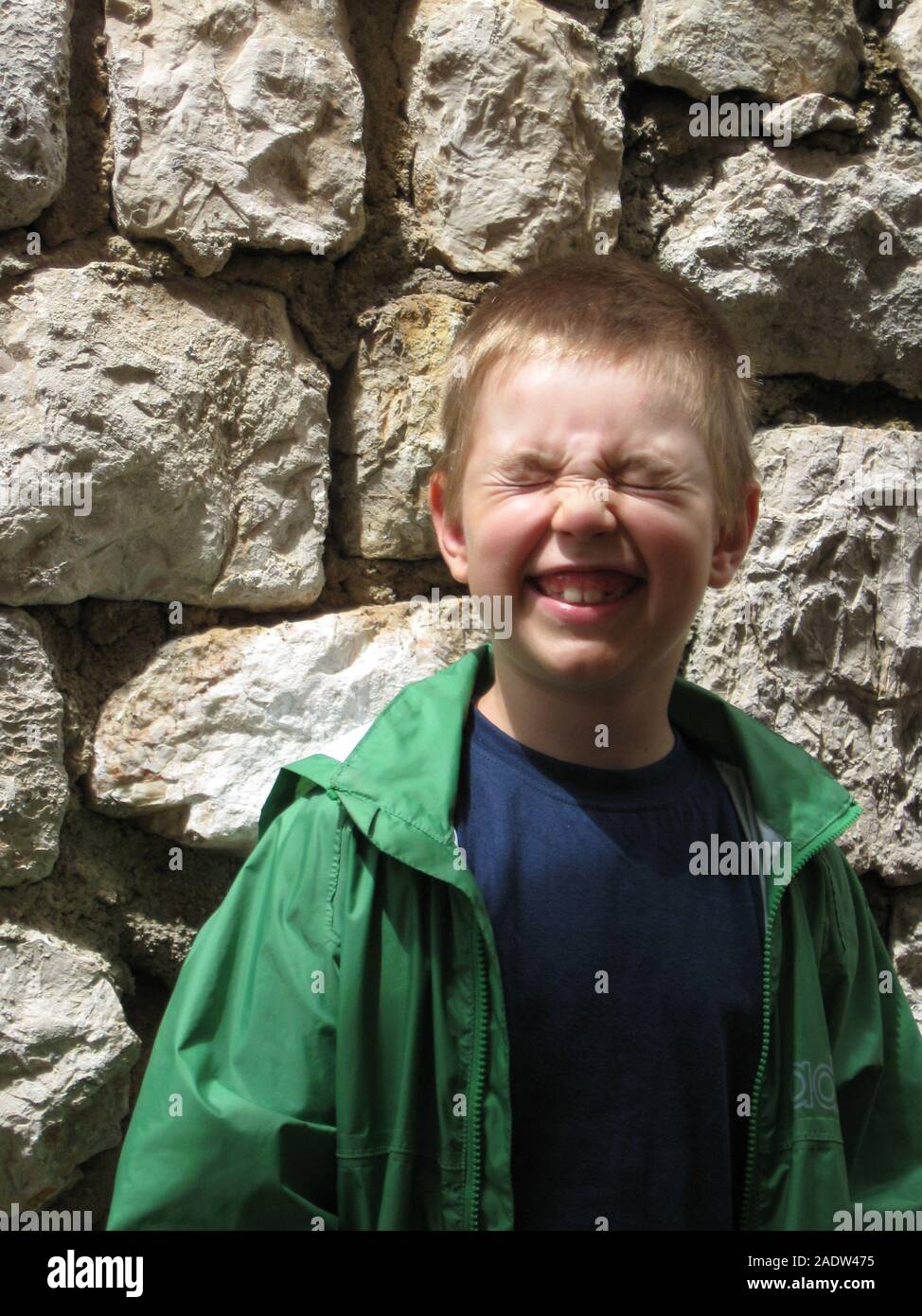Boy portrait, stony background, funny face expression Stock Photo - Alamy