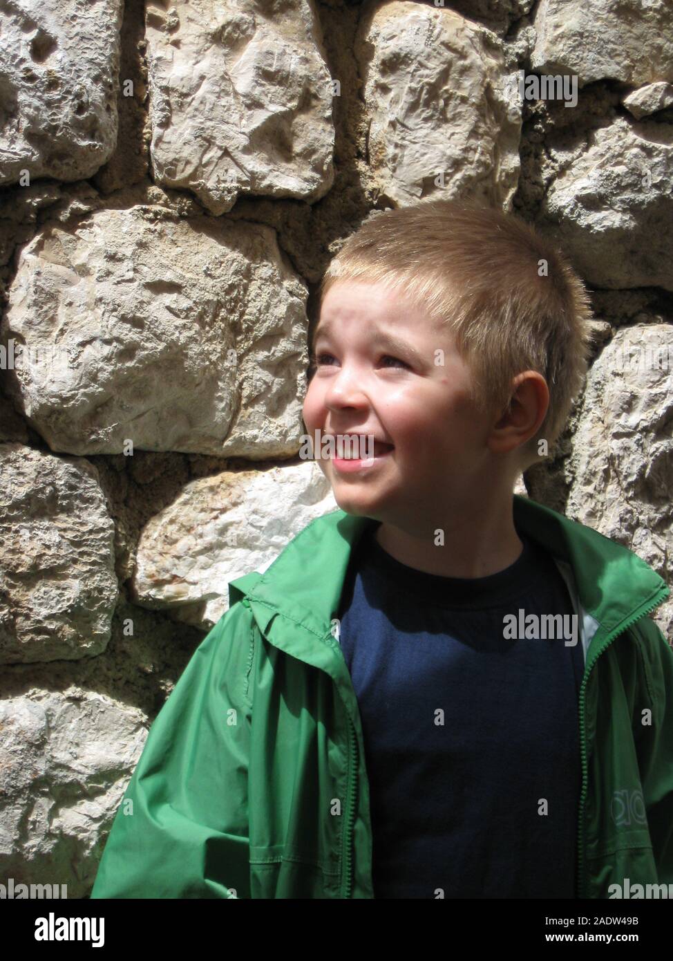 Boy portrait, stony background, funny face expression Stock Photo - Alamy