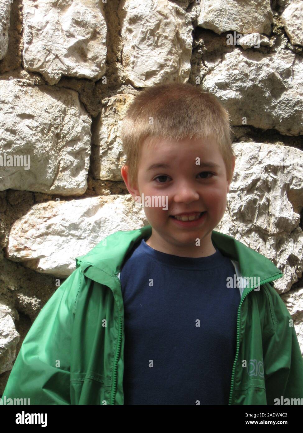 Boy portrait, stony background, funny face expression Stock Photo - Alamy