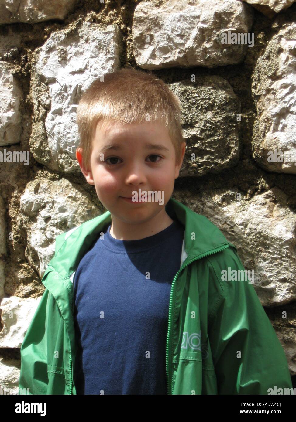 Boy portrait, stony background, funny face expression Stock Photo - Alamy