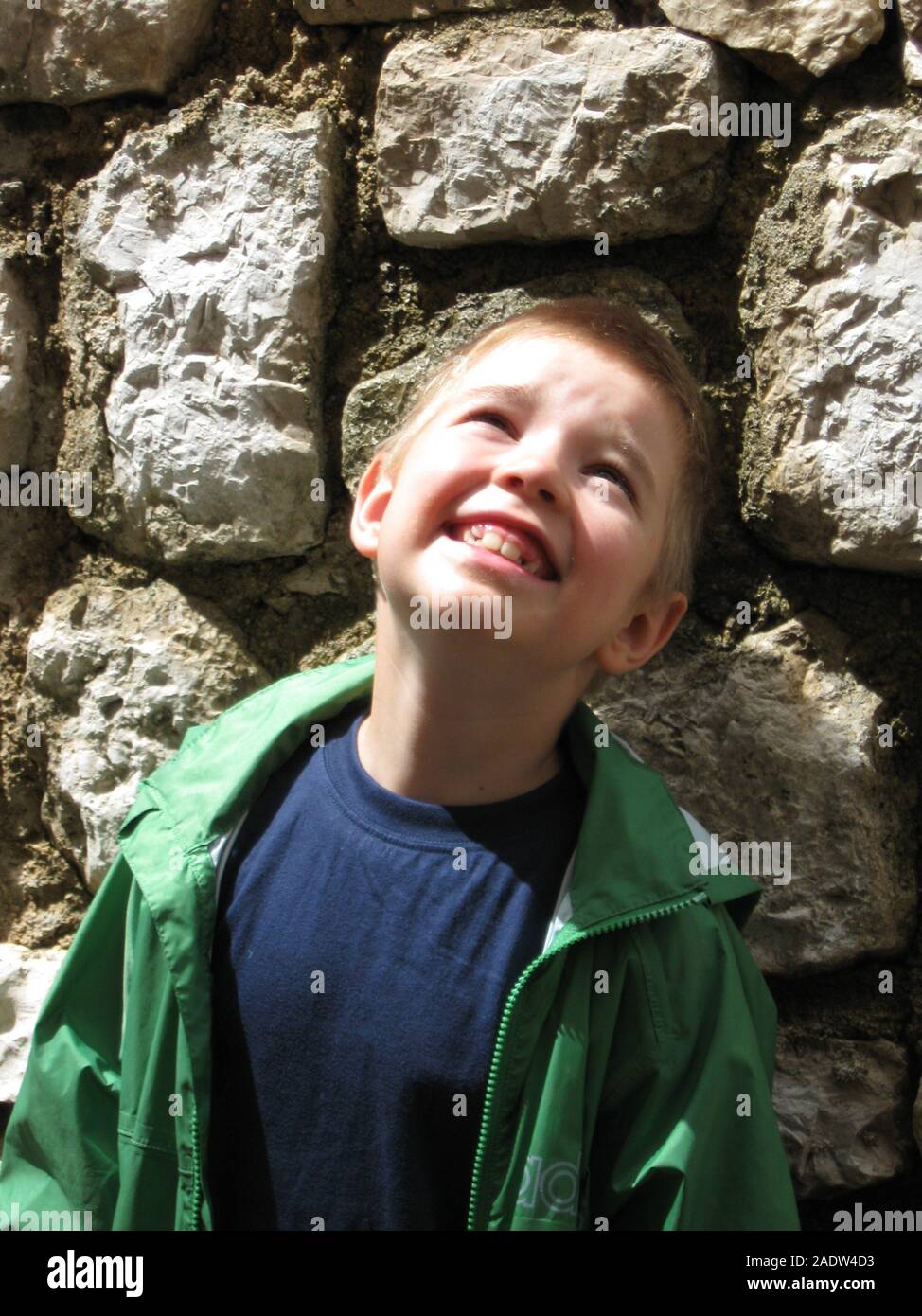 Boy portrait, stony background, funny face expression Stock Photo - Alamy