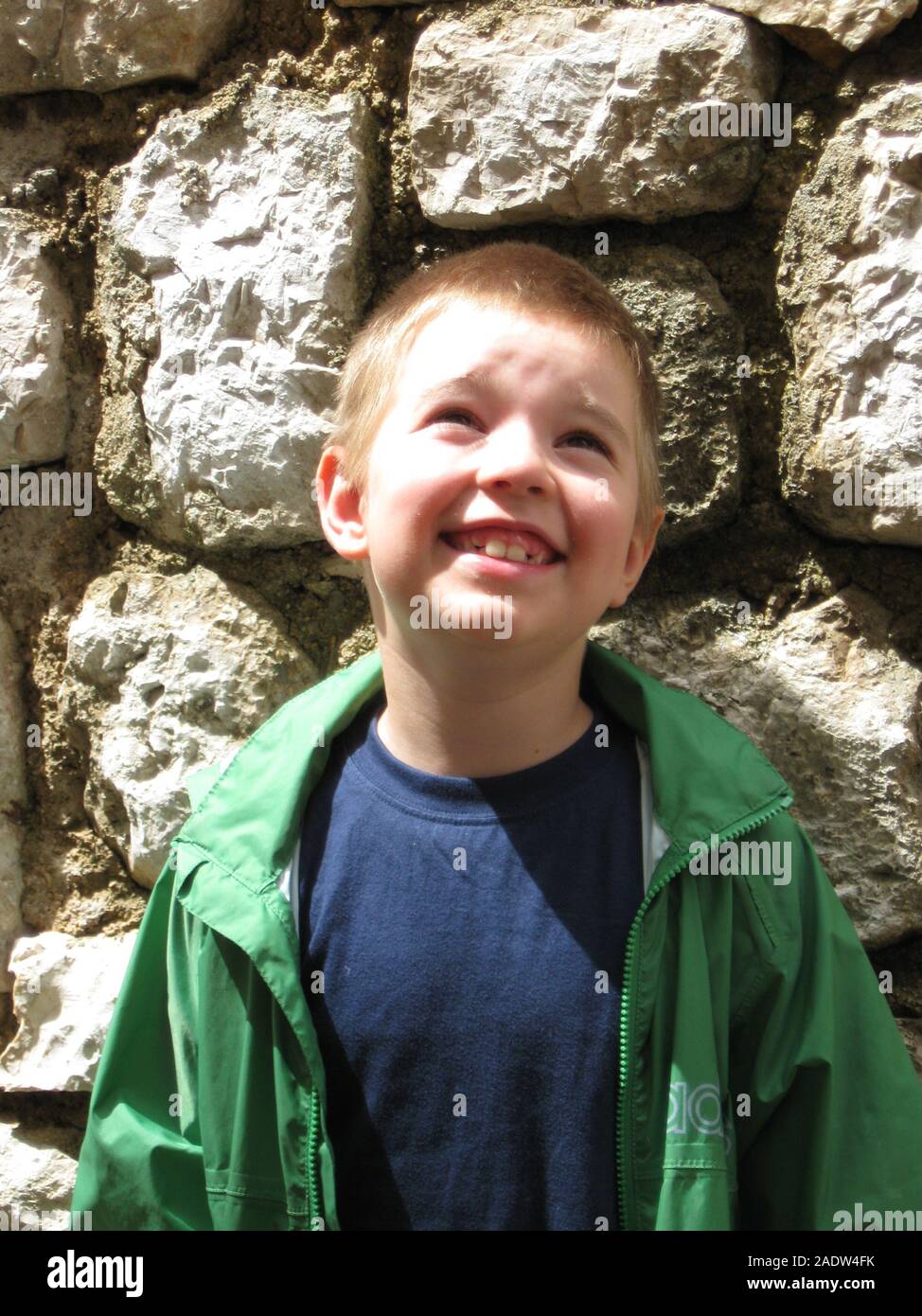 Boy portrait, stony background, funny face expression Stock Photo - Alamy