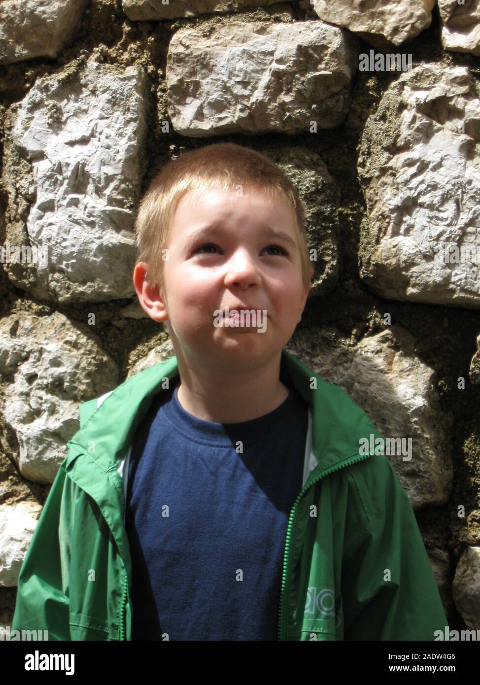 Boy portrait, stony background, funny face expression Stock Photo - Alamy